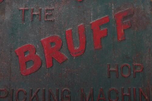 An original cast iron sign ‘The Bruff Hop Picking Machine’