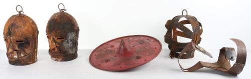 A box containing two reproduction wrought iron medieval scolds bridle ...