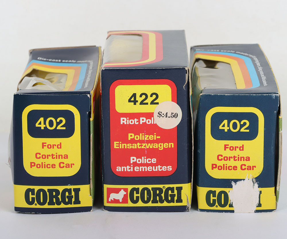 Three Boxed Corgi Police Cars