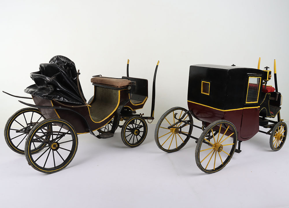 Two wooden model Victorian style carriages,
