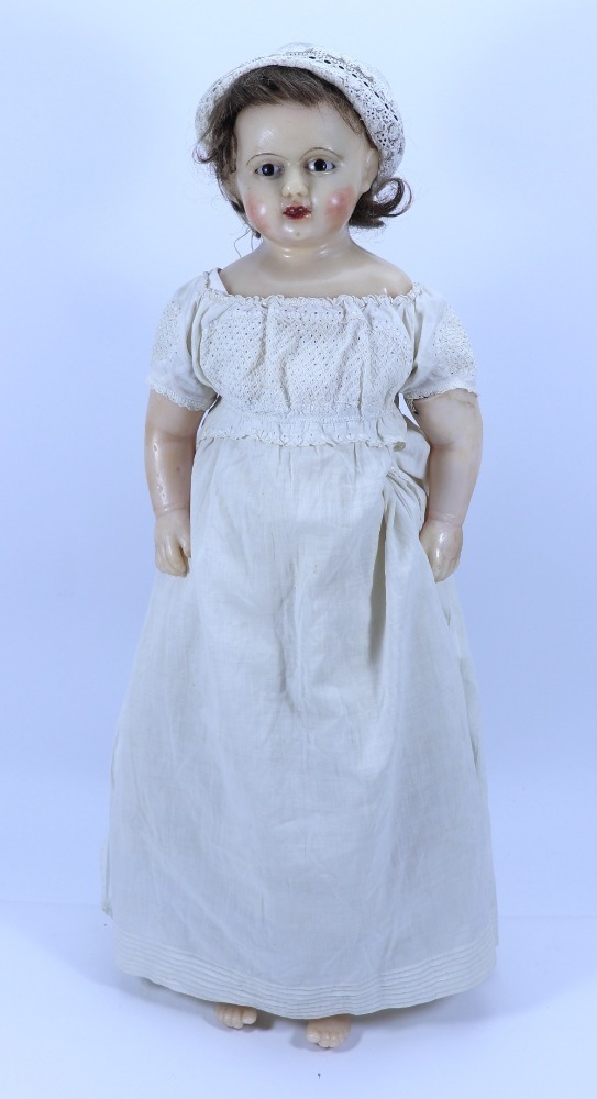 A rare early poured wax shoulder head doll with painted teeth, English ...