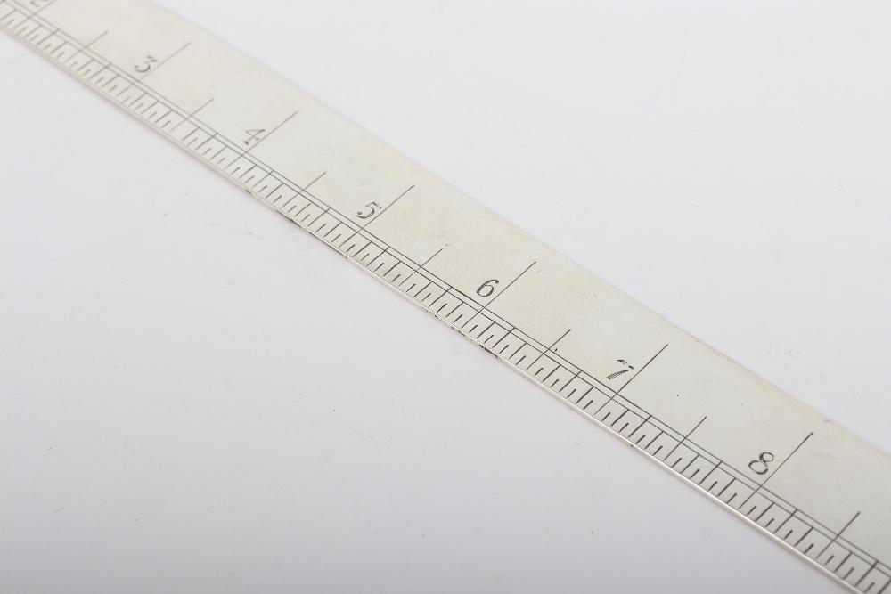 An early 20th century silver rule, Drew & Sons, London 1919