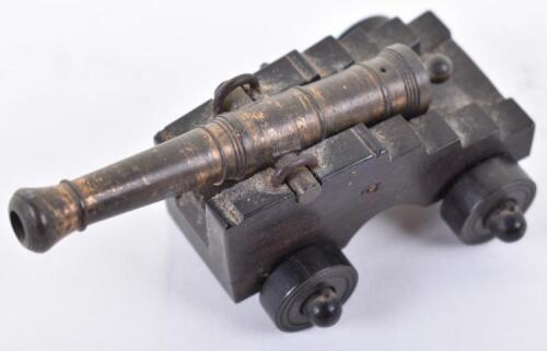 A small model of a ship’s cannon